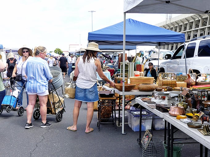 Treasure hunters navigate the aisles with their trusty carts, ready to pounce on vintage kitchenware that grandma would recognize in a heartbeat.