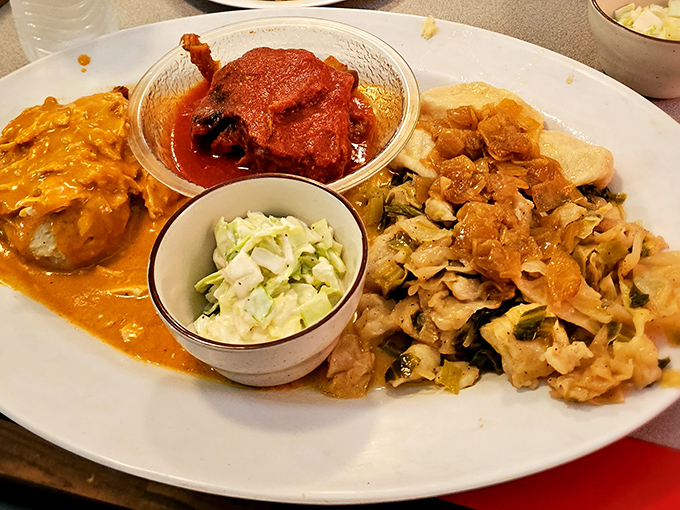 The Hungarian platter that answers the eternal question: "Why choose one delicious thing when you can have three?" That coleslaw provides the perfect fresh counterpoint.