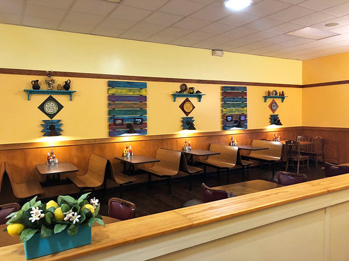 Cheerful yellow walls adorned with colorful shelves create a space where calories don't count and diet plans go to die.