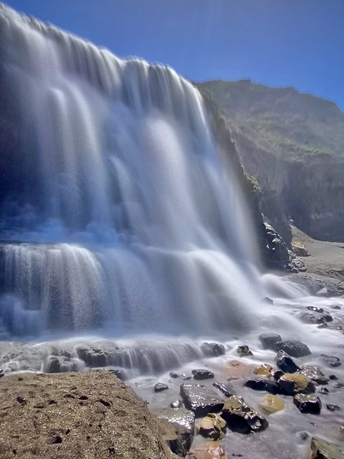Sunlight transforms falling water into a silky curtain of white, proving that Mother Nature remains the world's greatest special effects artist.