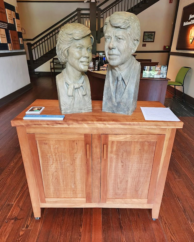 Sculpted busts of Jimmy and Rosalynn Carter stand together, a testament to their enduring partnership and service.