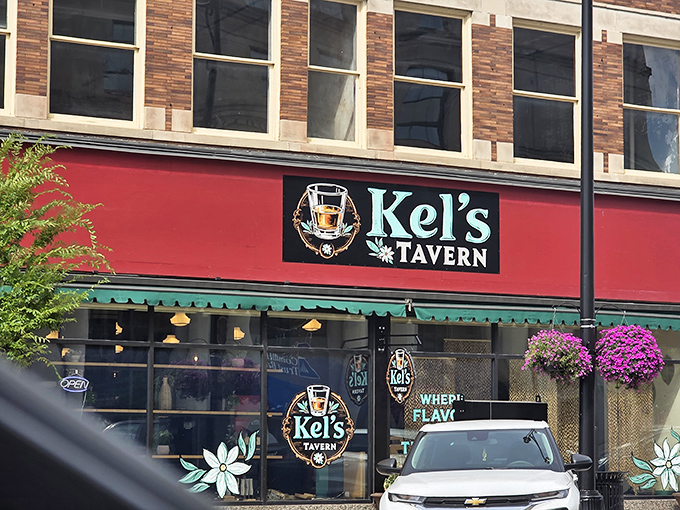 Kel's Tavern's inviting red awning and hanging plants practically whisper "come in and stay awhile" to passersby seeking liquid refreshment.