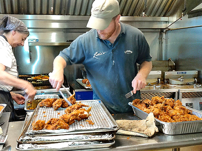 Where the magic happens&mdash;skilled hands transforming simple ingredients into Delaware legends. That chicken isn't just fried; it's being elevated to art form.