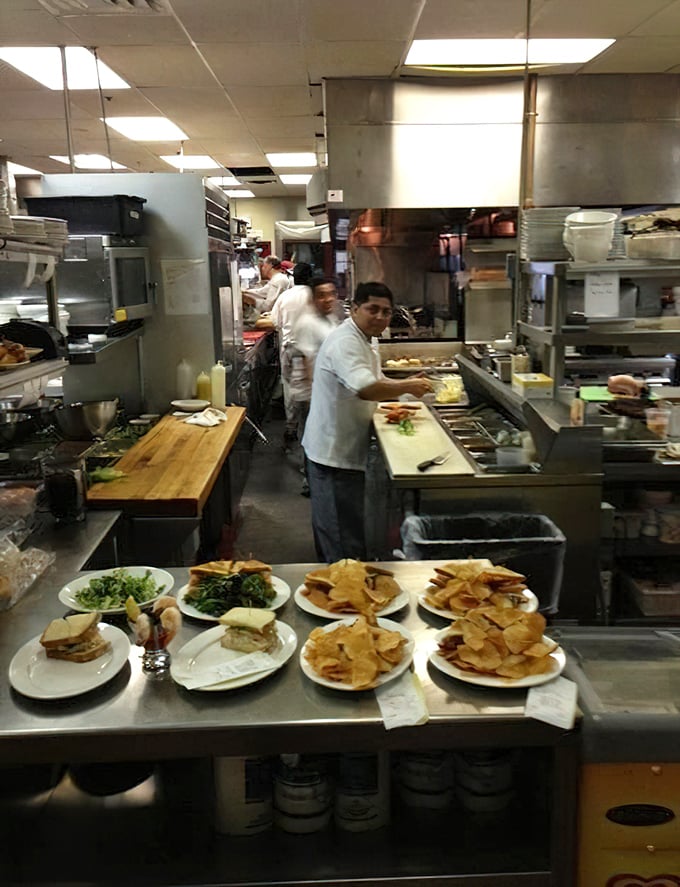 Where the magic happens: the kitchen team works their culinary alchemy, transforming fresh ingredients into the dishes that have made this inn legendary.