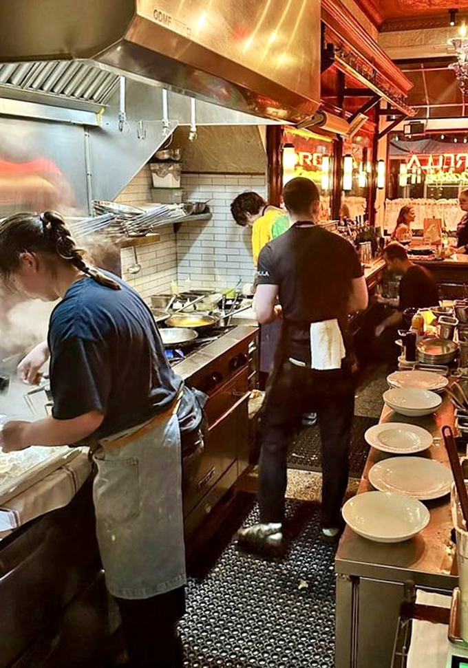 Steam rising from pots like culinary ghosts, chefs moving with practiced precision. This kitchen ballet produces dishes worth driving across state lines for.