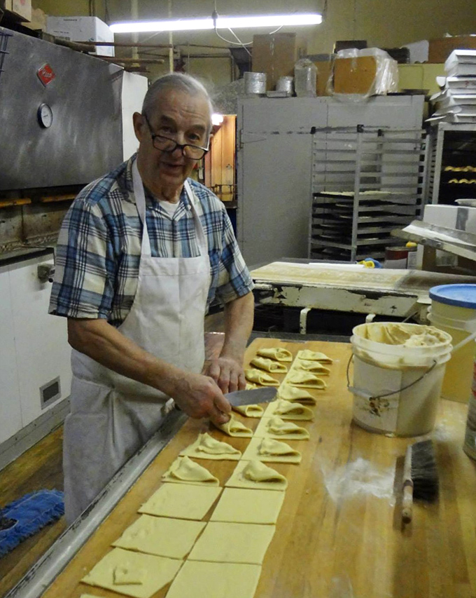 Skilled hands crafting pastry magic&mdash;this is where the dough whispering happens before dawn while most of us are still dreaming.