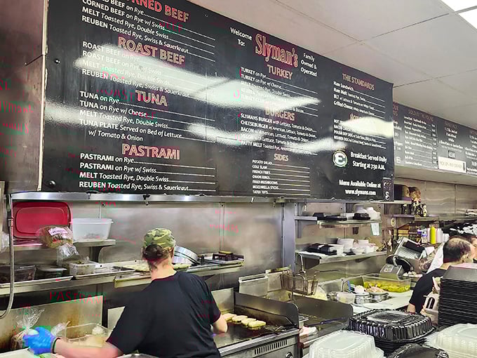 The kitchen crew moves with the precision of a well-rehearsed orchestra, except their instruments produce sandwiches instead of symphonies.