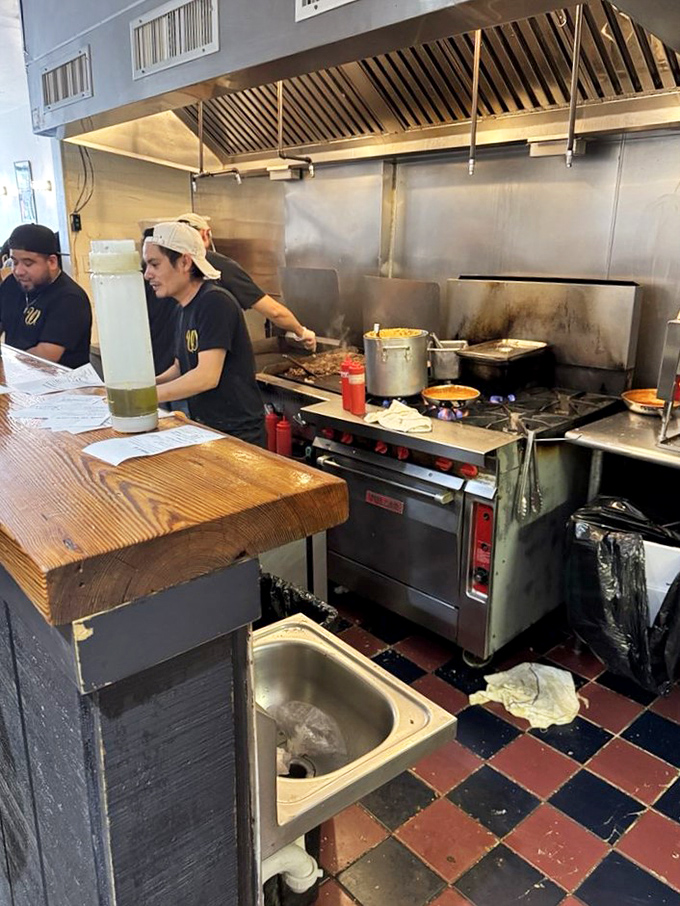 Behind the scenes magic where culinary alchemy happens. The kitchen staff moves with the choreographed precision of sandwich ballet performers.