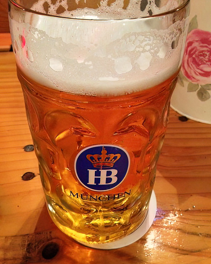 An authentic German lager in a proper dimpled mug with foam worthy of its Munich heritage, refreshment with European credentials.