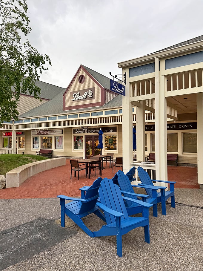 Blue Adirondack chairs outside Lindt Chocolate Shop&mdash;the perfect spot to contemplate life's important questions, like "How many truffles is too many?"