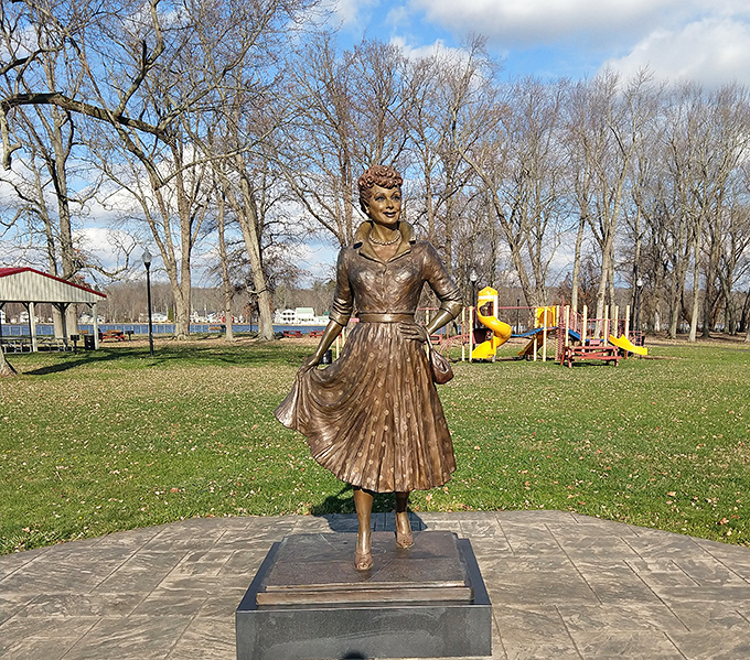 Lucy's bronze statue captures that infectious spirit, forever mid-laugh in a park that bears her name.