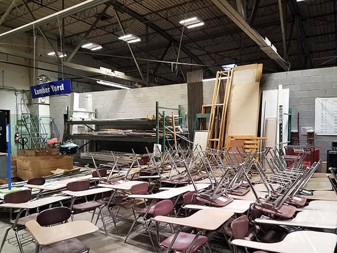 An unexpected classroom emerges in the lumber yard, where these chairs have clearly heard lectures on everything from algebra to zoology.