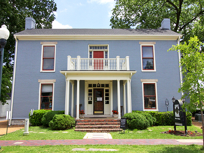 The Maney-Gaut Shuff House's powder-blue charm and welcoming porch embody the architectural equivalent of a warm Southern handshake.