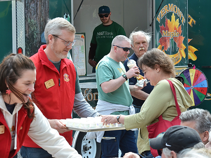 Vermont's liquid gold flows freely during Maple Festival season. These volunteers know they're handling the state's most precious natural resource.