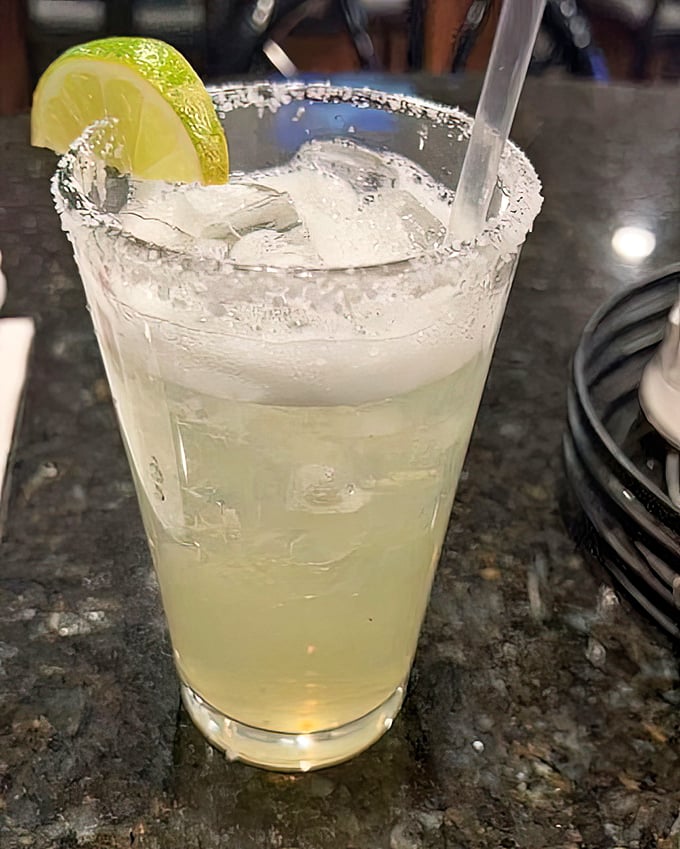 A proper margarita with its salt-rimmed crown and lime garnish&mdash;because sometimes adulting requires tequila and lime in perfect harmony.