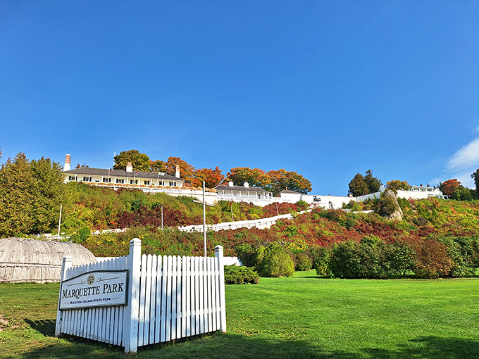 Marquette Park's pristine grounds and white picket fence offer a peaceful foreground to the hillside homes that cascade down to the waterfront.