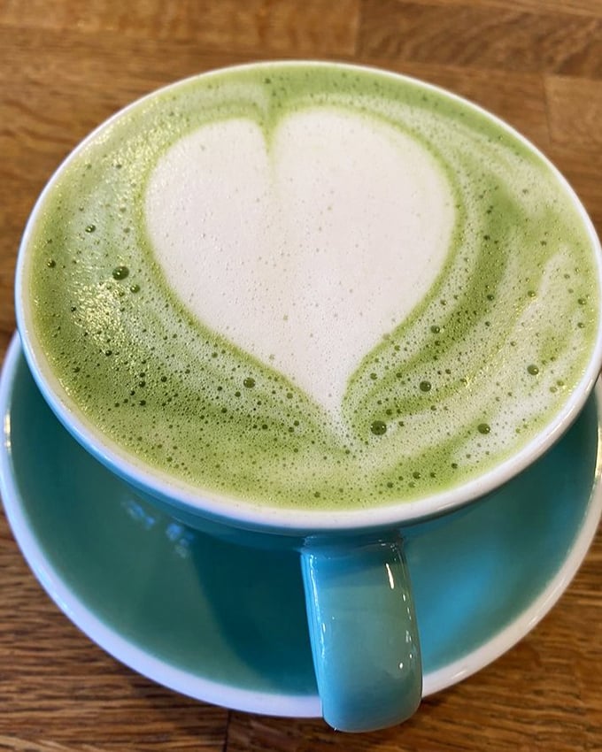A matcha latte with heart—literally and figuratively—offering a moment of zen before diving into the glorious carb-fest that awaits.