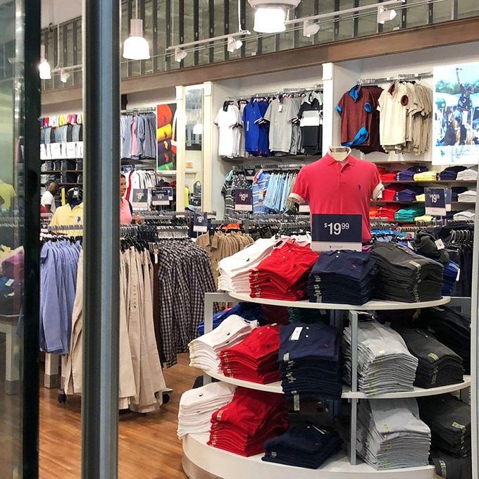 Polo shirts stacked with military precision in a patriotic palette. The unofficial Florida retiree uniform, now at prices that won't drain the 401(k).