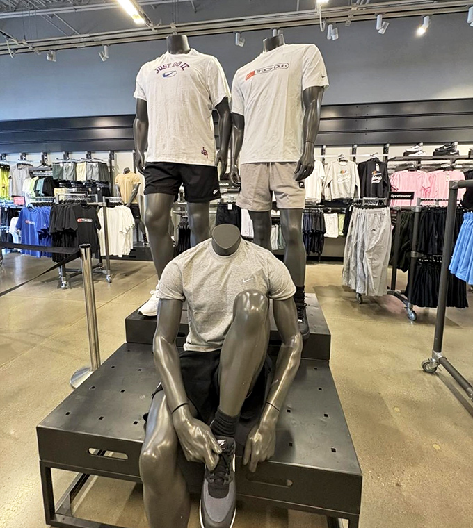 Men's athleisure displays where mannequins sit contemplatively, perhaps pondering why they need another gray t-shirt (spoiler: you always do).