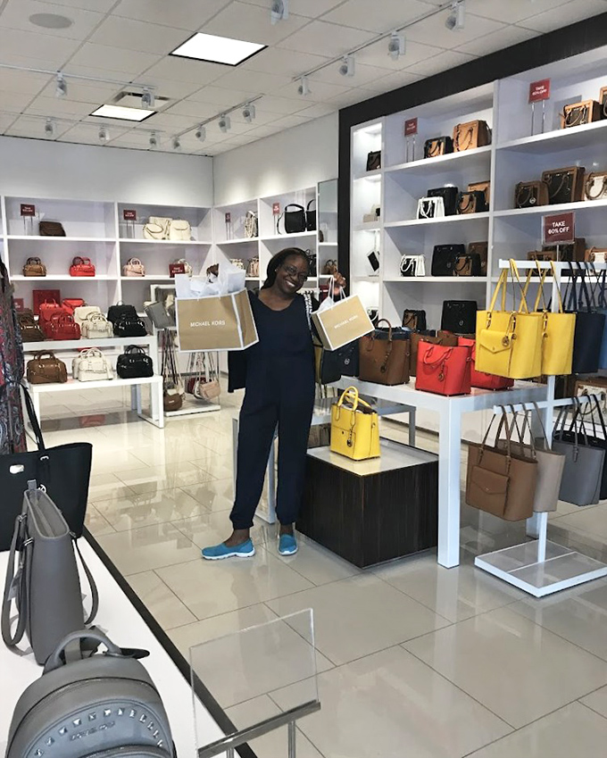 Victory looks like this&mdash;shopping bags in hand and the satisfaction of knowing you've just scored Michael Kors without the Manhattan price tag.