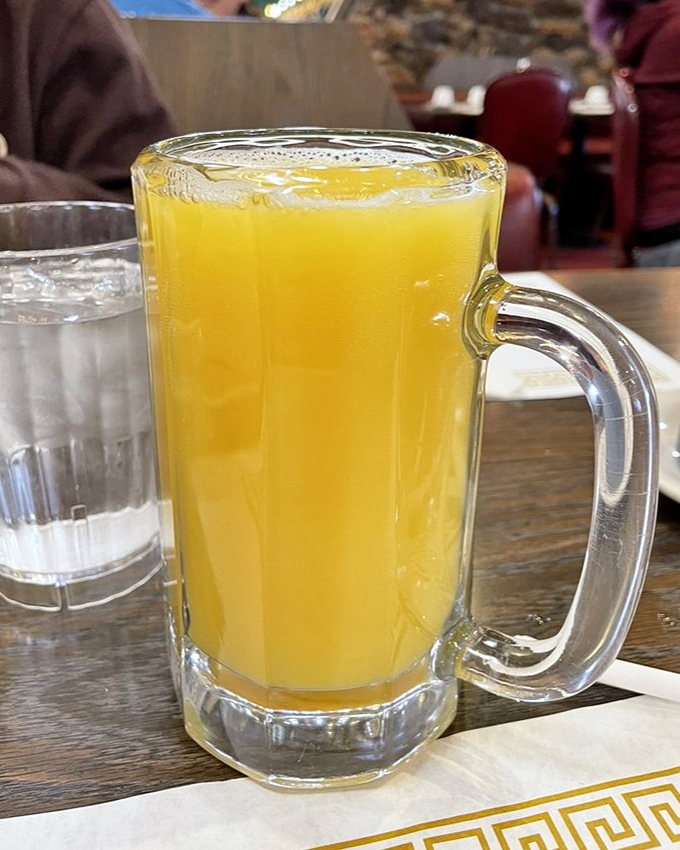 A mimosa served in a mug the size of a small swimming pool. Because sometimes breakfast calls for a champagne celebration in glassware that means business.