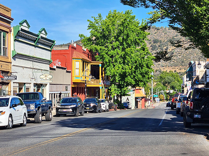 Miner Street's colorful buildings pop against the mountain backdrop &ndash; a downtown where chain stores haven't muscled out the locals.