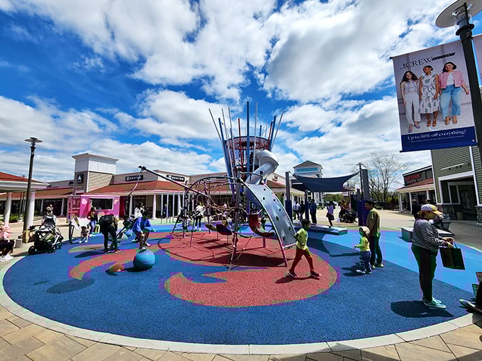 A playground oasis where tiny shoppers burn energy while parents catch their retail breath.