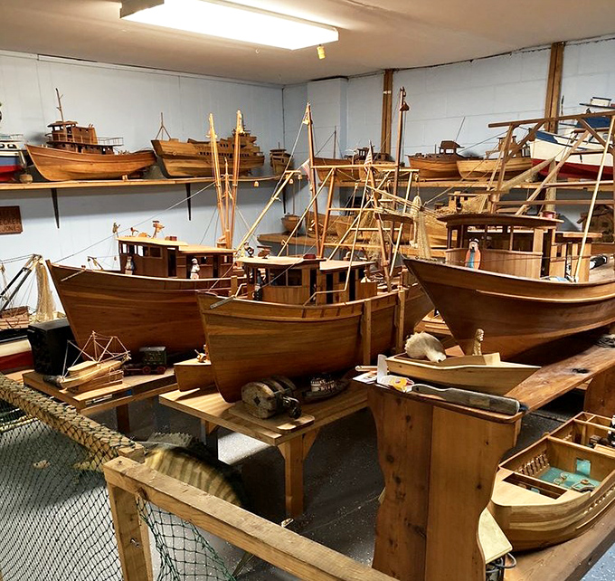 A museum-worthy collection of model boats reminds you that your meal began its journey on vessels just like these.