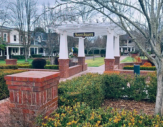 Nunan Square's garden entrance welcomes visitors with a touch of formality that says, "Yes, we take our flowers seriously around here."