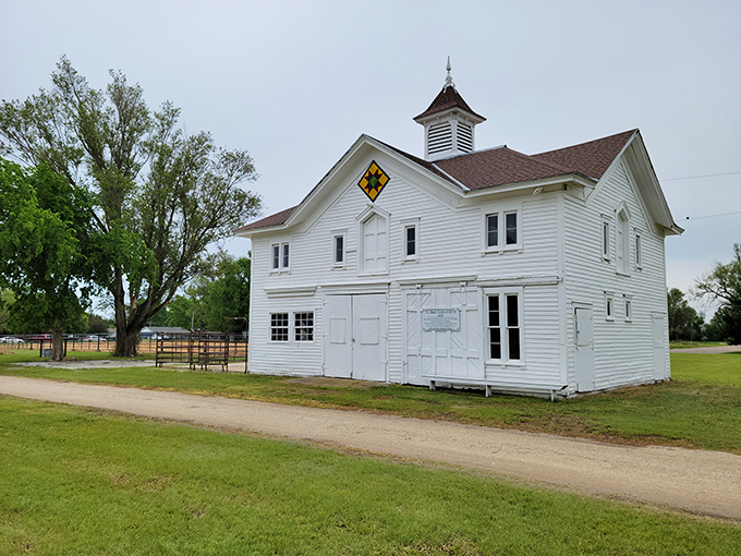 This pristine white barn with its quilt square emblem represents the agricultural heritage that remains central to Abilene's identity.