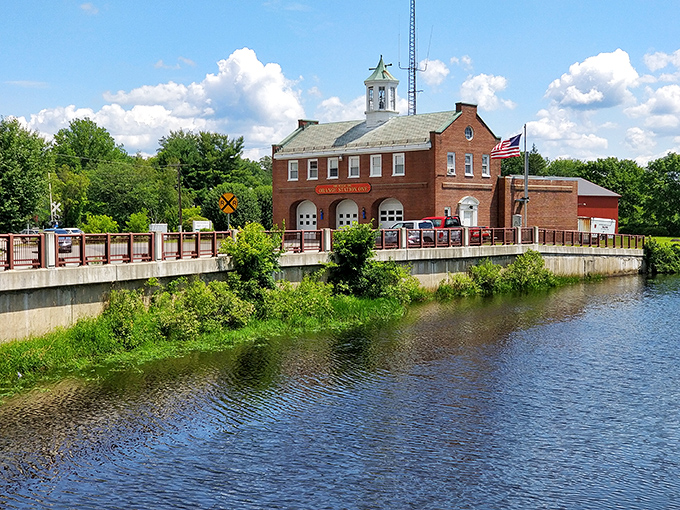 The historic fire station sits ready by the river, protecting a community that actually remembers what affordable means.