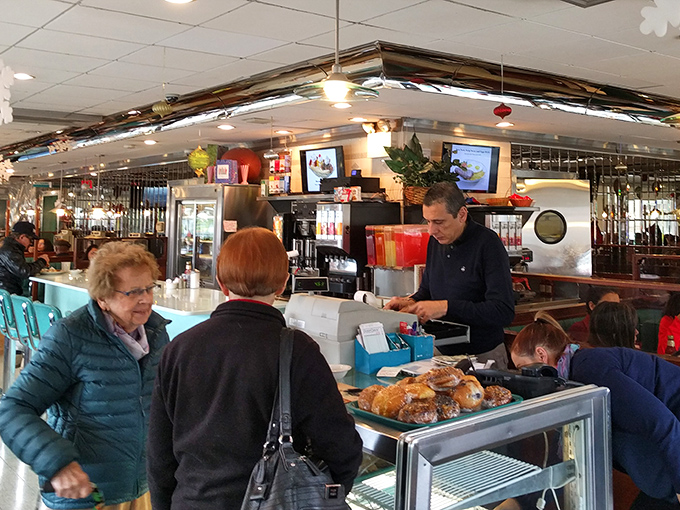 Colorful decorations brighten the counter area, creating that perfect balance of kitsch and comfort. Diner feng shui at its finest.