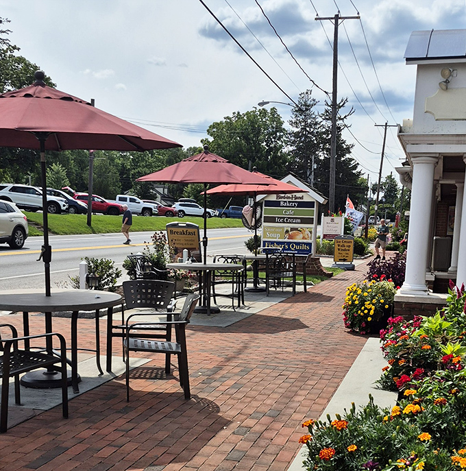 Outdoor seating that invites you to watch the world go by, one bite at a time. Red umbrellas provide shade while you contemplate a second whoopie pie.