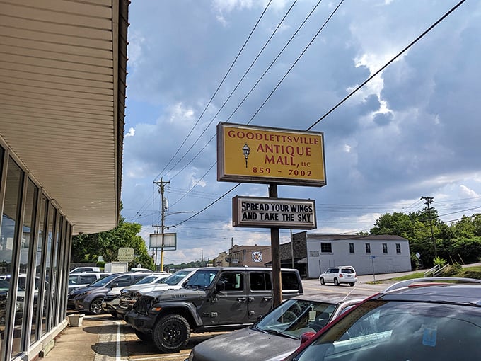 Summer skies frame the Goodlettsville Antique Mall sign with its philosophical reminder to "spread your wings and take the sky." Vintage wisdom indeed.