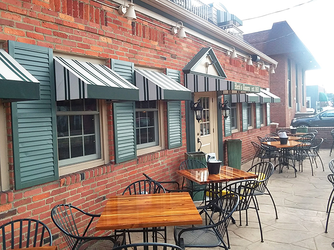 The sidewalk seating area offers a front-row view to Rocky River life, where wooden tables have supported countless elbows, plates, and heartfelt conversations.