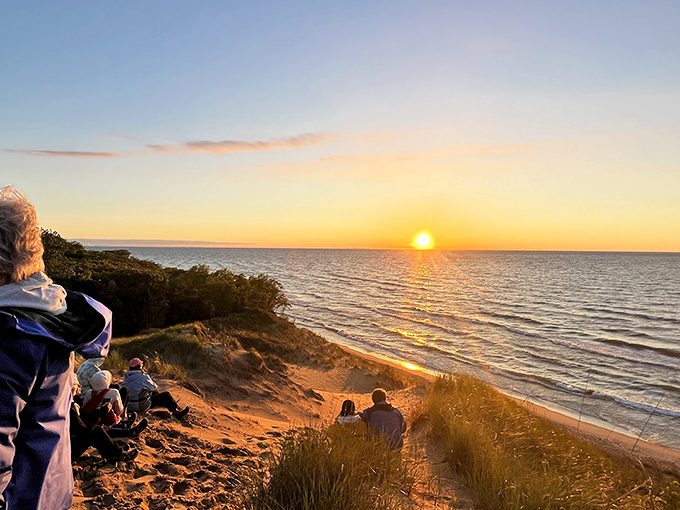 Sunset pilgrims gather on Mount Baldy's summit. Some views are worth every step of the climb, especially when shared.