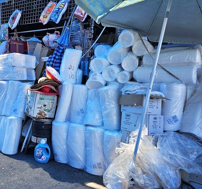 Household necessities stacked with care. From paper products to cleaning supplies, the practical side of the swap meet keeps Arizona homes running smoothly.