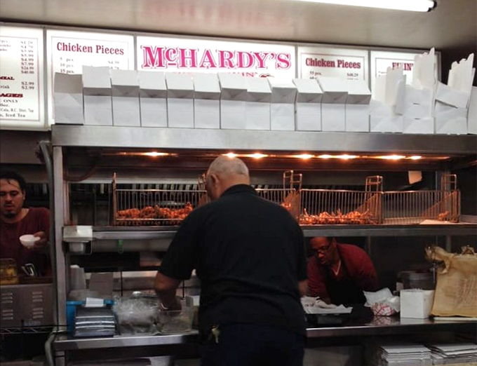 A glimpse behind the counter reveals the magic happening in real-time. Fried chicken alchemy at its finest.