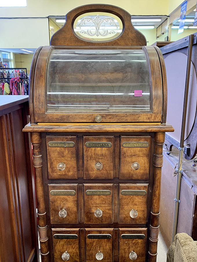 An apothecary cabinet that once organized remedies now stands ready to store treasures, secrets, or possibly both.