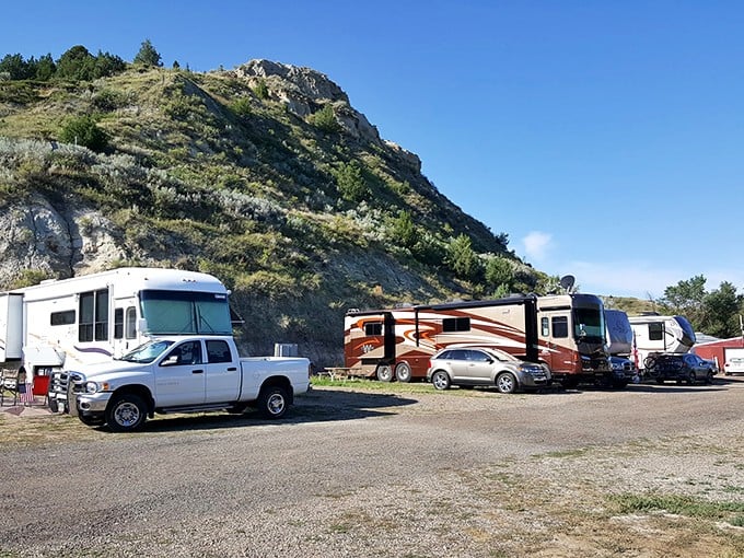 At Red Trail Campgrounds, RVs gather like modern-day wagon trains beneath buttes that have witnessed centuries of travelers seeking western adventure.