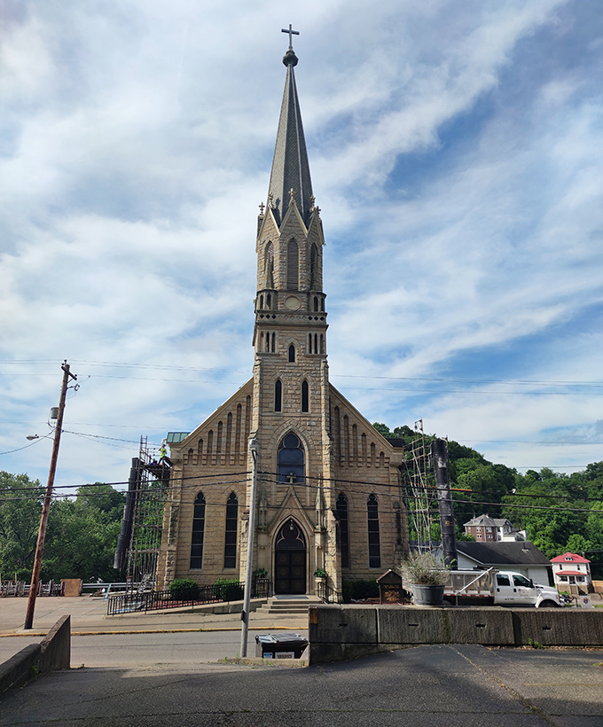 Sacred Heart Church reaches skyward with a spire that seems to say, "Yes, spiritual fulfillment and affordable living can coexist beautifully."