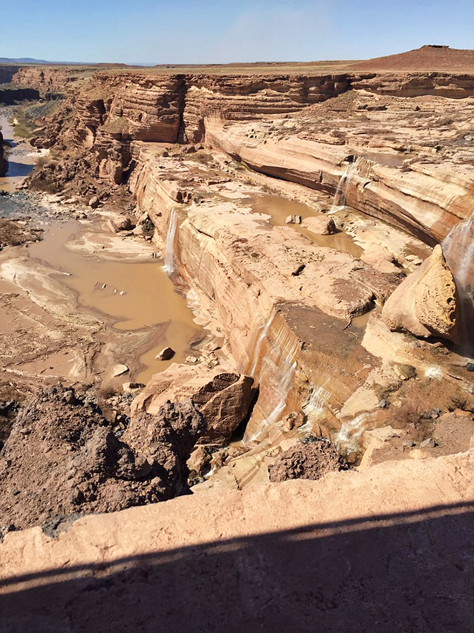 The stratified sandstone cliffs showcase Arizona's layered history&mdash;each stripe representing thousands of years of geological storytelling.