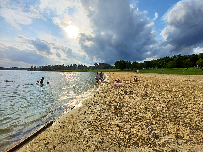Golden hour transforms this beach into a painter's dream. The mountains stand guard while families create memories at water's edge.