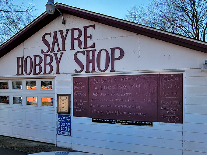 The Sayre Hobby Shop's charmingly direct signage promises a haven for model enthusiasts and a "treatment center" for those afflicted with the hobby bug.