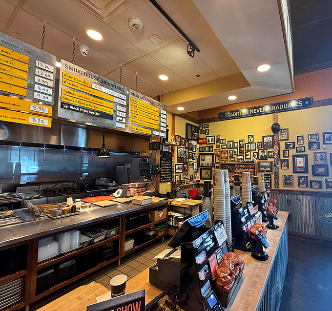The service counter where magic happens&mdash;yellow menu boards promise smoky delights while staff members orchestrate your barbecue dreams with military precision.