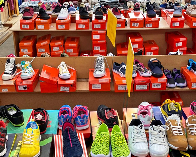 Shoes organized with military precision, offering everything from practical sneakers to those impulse-buy sandals you'll definitely wear.