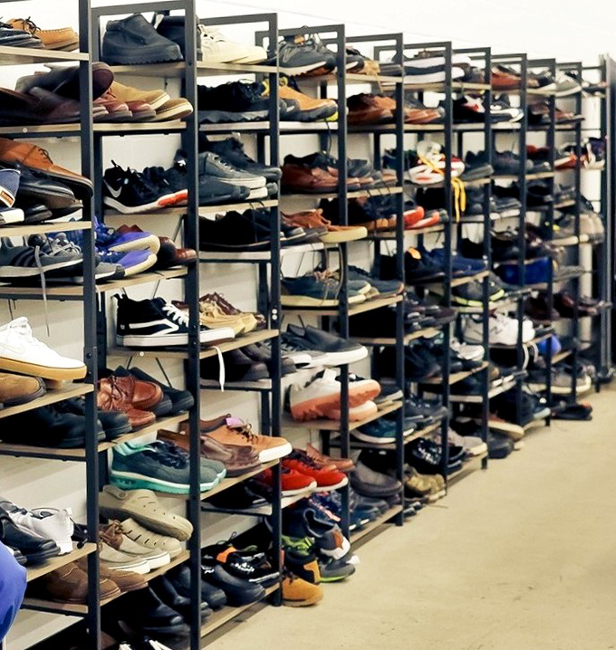 Shoe paradise where barely-worn loafers, sneakers, and dress shoes stand at attention, ready for their second dance across Indiana sidewalks.