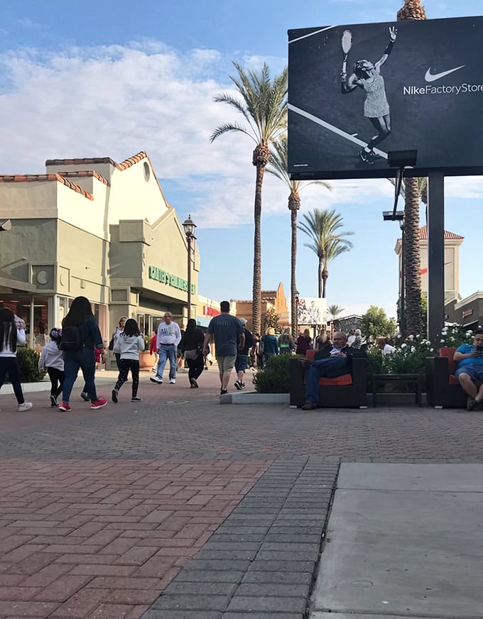 The bustling walkways of Lake Elsinore Outlets, where shoppers move with the determined grace of people who know exactly what they want: bargains.