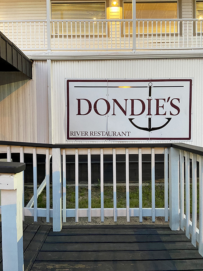 The sign promises river dining, and Dondie's delivers. That anchor logo isn't just decoration&mdash;it's a symbol of culinary stability.