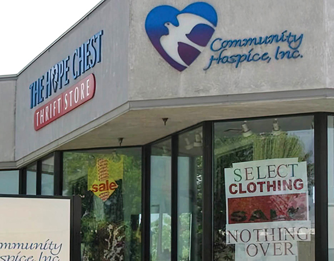 The storefront sign promises more than just shopping&mdash;it's a beacon of community support where every purchase serves a greater purpose.